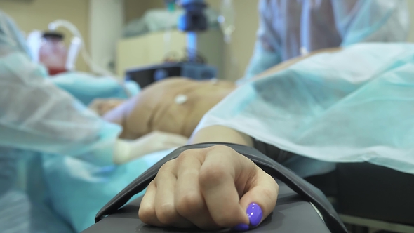 Doctor Performs an Operation of Liposuction To a Patient, Stock Footage