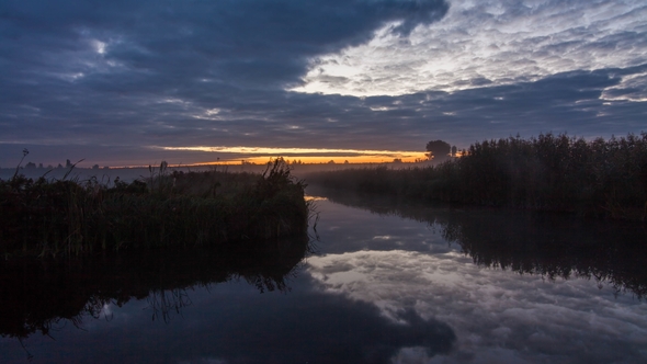 Lake in Spring at Dawn. Reflection of Clouds in Water, Stock Footage