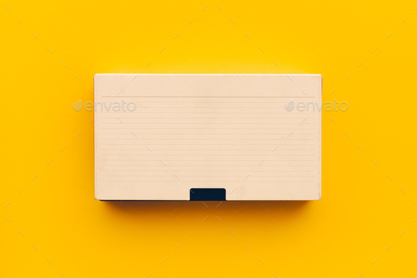 VHS video cassette on yellow background Stock Photo by stevanovicigor