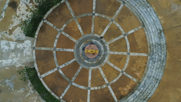 Aerial A Girl Walking Around Circle Monument Clockwise Stock Footage