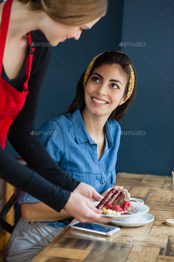 Smiling owner serving sweet food Stock Photo by Wavebreakmedia | PhotoDune