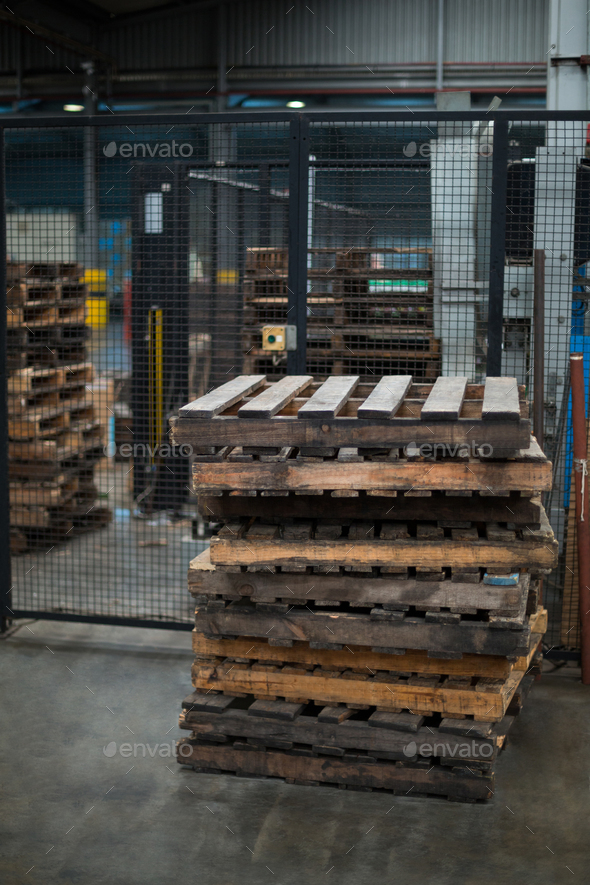 Stack of pallets in factory Stock Photo by Wavebreakmedia | PhotoDune