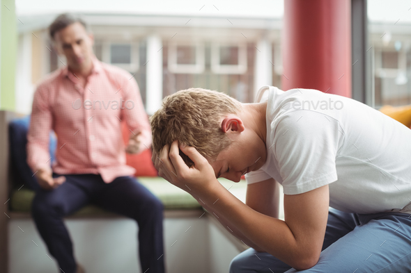Teacher scolding student in library Stock Photo by Wavebreakmedia ...