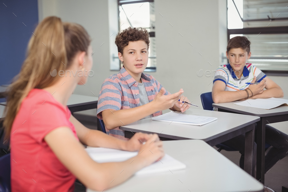 Students studying in classroom Stock Photo by Wavebreakmedia | PhotoDune