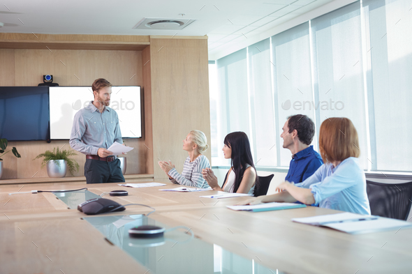 Business people discussing at conference table during meeting Stock ...