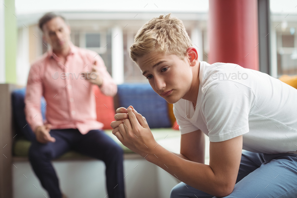 Teacher scolding student in library Stock Photo by Wavebreakmedia ...