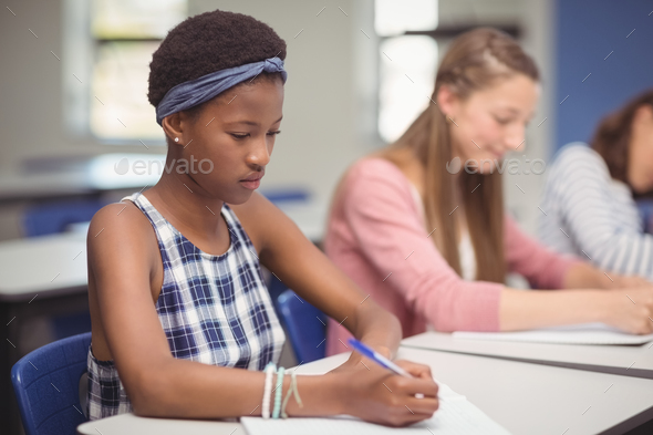 Students studying in classroom Stock Photo by Wavebreakmedia | PhotoDune
