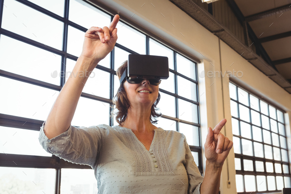 Business executive wearing virtual reality headset Stock Photo by ...