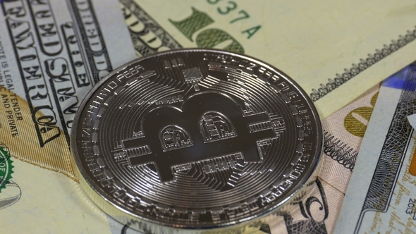 Silver Bitcoin Coin, BTC and Bills of Dollars Are Rotating, Stock Footage