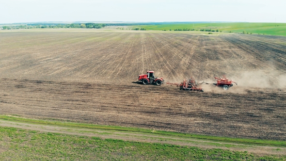 Plowing Tractor Rides on a Big Field, Stock Footage | VideoHive