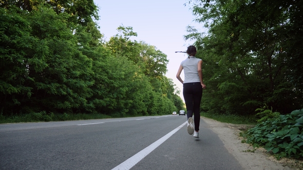 Woman Runner Running on Open Road in Countryside, Stock Footage | VideoHive