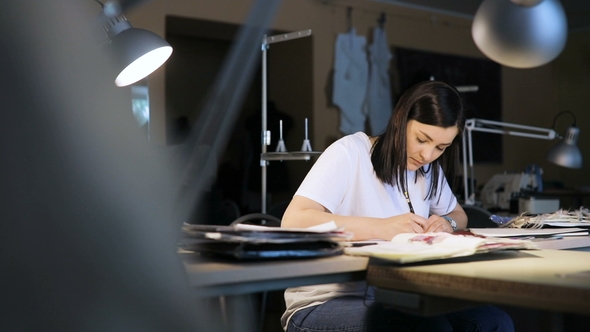 Female Fashion Designers Drawing Sketches for Clothes in Atelier, Stock ...