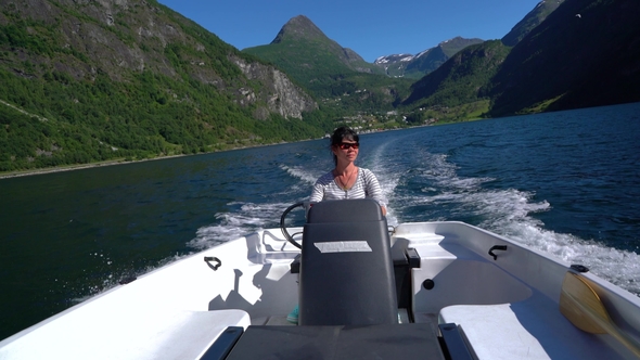 Woman Driving a Motor Boat, Stock Footage | VideoHive