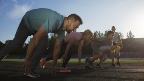 Family Running Sprint for Time on Stadium, Stock Footage | VideoHive