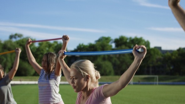 Woman with Kids Exercising on Sports Ground, Stock Footage | VideoHive