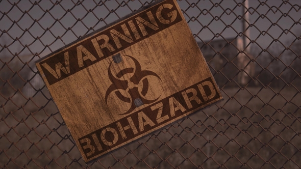 Biohazard Sign Attached To a Chain Link Fence Warns of the Danger That ...