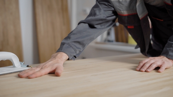 Builder Sanding a Piece of Hard Wood in a Workshop., Stock Footage