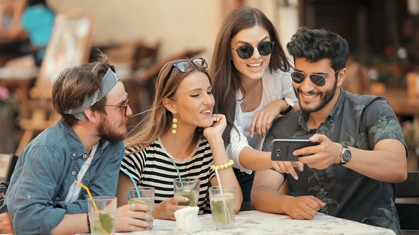 Friends Look Pictures Over on Phone, Stock Footage | VideoHive