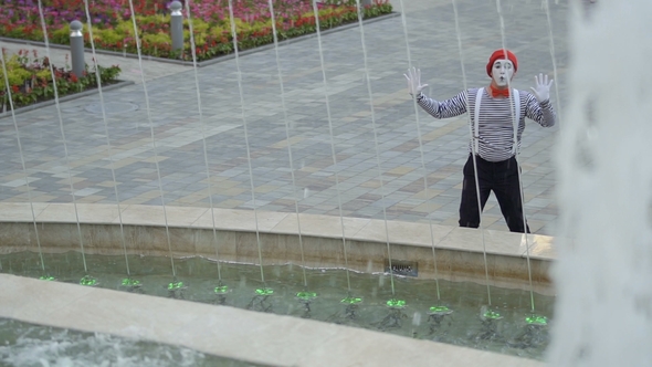 Funny Mime in Red Beret Touching Invisible Wall Near Fountains, Stock ...