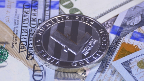 Silver Litecoin Coin, LTC and Bills of Dollars Are Rotating, Stock Footage