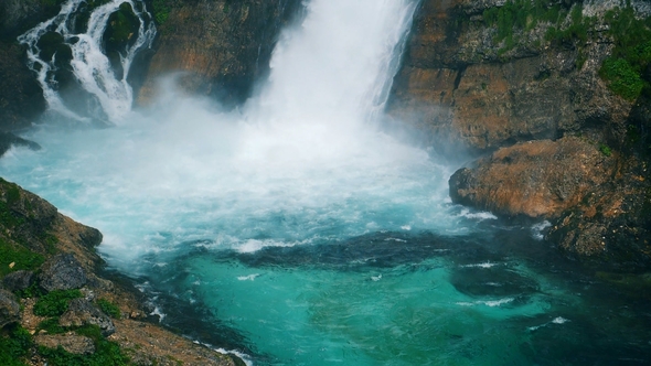 Clear Lake Water Near a Waterfall. Water From the Waterfall Is Entering ...