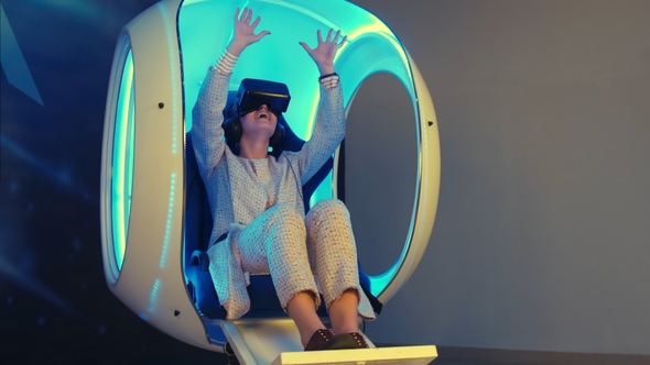 Emotional Woman Experiencing Virtual Reality in a Moving Interactive ...