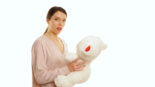 Girl Is Surprised By the White Teddy Bear with Red Pieces, Isolated ...