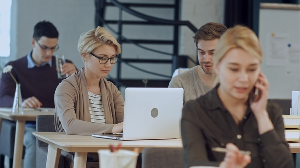 Busy Design Office with Workers at Desks, Stock Footage | VideoHive