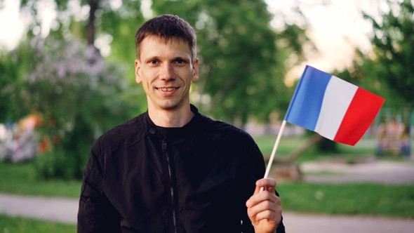 Portrait of Frenchman Waving National Flag Looking at Camera and ...