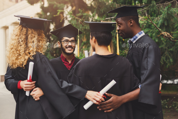 Graduates having a group hug Stock Photo by Prostock-studio | PhotoDune