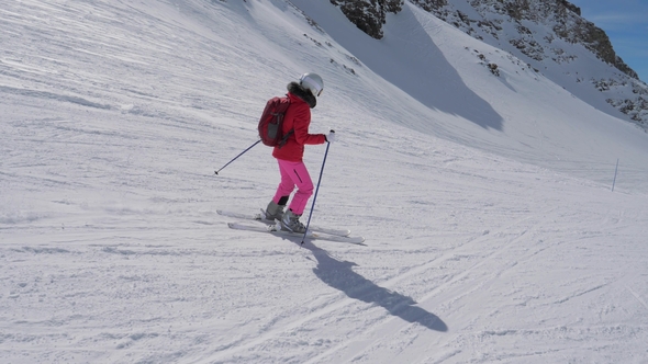 In Movement Side View, Woman Skier Skiing Downhill Of The Mountain ...