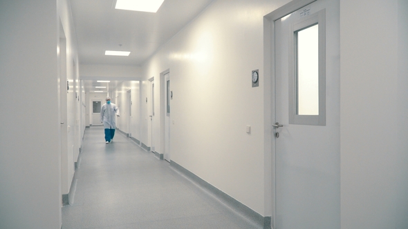 Worker of Hospital Walk Through Corridor Into One of the Rooms, Stock ...