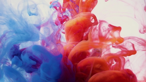 Blue and Red Ink Mixing Together Over a Pure White Background, Stock ...