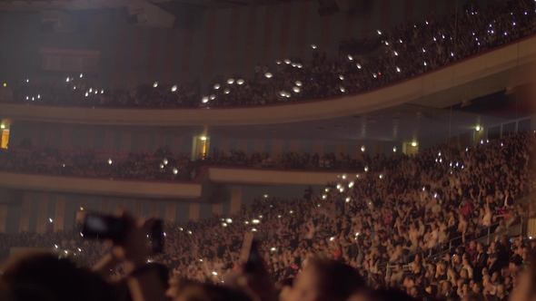 Audience Waving Hands and Mobile Flashlights at the Concert, Stock Footage