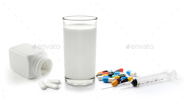 pill and glass of milk isolated on white background Stock Photo by sommai