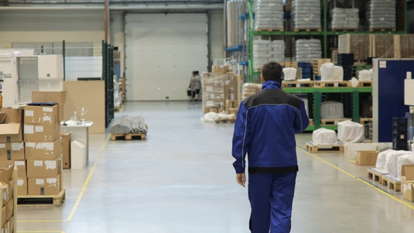 Follow Footage of Factory Worker That Is Walking Through Industrial ...