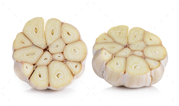 Head of garlic cut in half on white background Stock Photo by sommai
