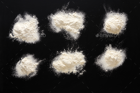 Sprinkled wheat flour splash spots on black background Stock Photo by ...