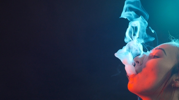 Young Woman in Bright Lights with Colorful Smoke, Stock Footage | VideoHive