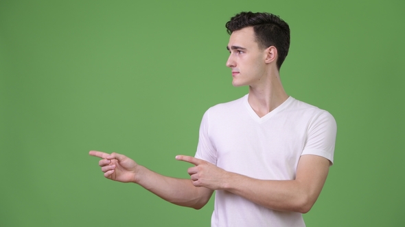 Young Handsome Man Showing Something, Stock Footage | VideoHive