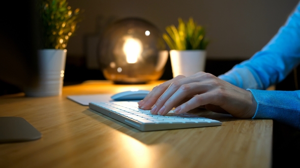 Woman Typing on Keyboard at Night, Stock Footage | VideoHive