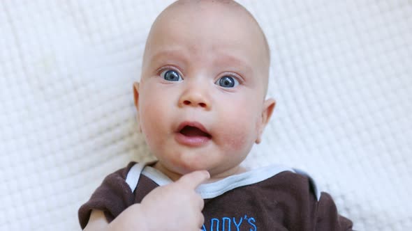 Caucasian Baby Portrait Grimacing Infant Looking to Camera Funny Face ...