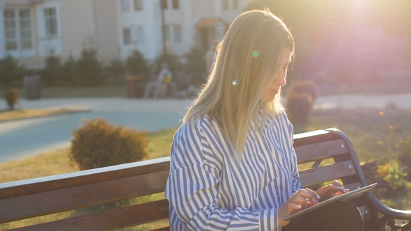 Young Girl with a Tablet on a Sunny Day, Stock Footage | VideoHive