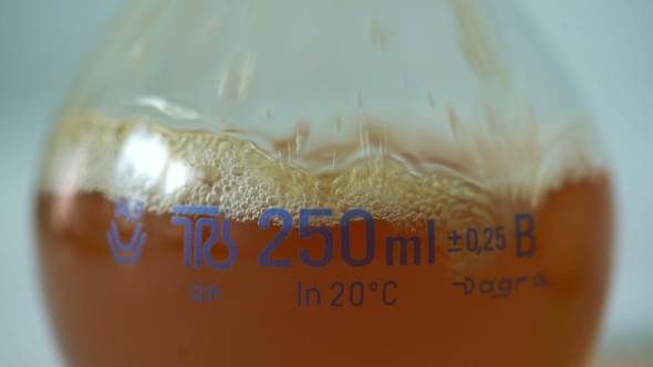 The Glass Bulb Is Filled with Liquid, Stock Footage | VideoHive