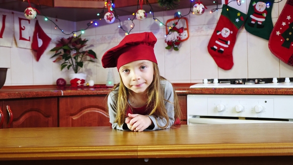 Portrait of Cute Little Girl Chef in the Christmas Kitchen, Stock Footage