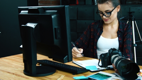 Photographer Working in Office, Stock Footage | VideoHive