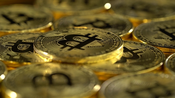 Bitcoin Coins Spin in a Circle and Shimmer., Stock Footage | VideoHive