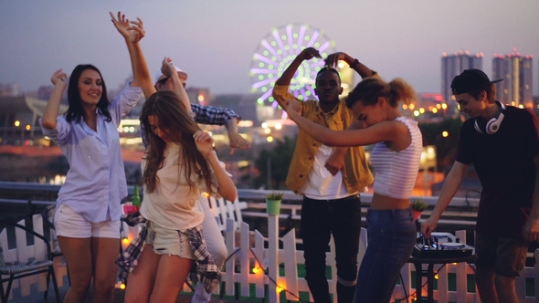 of Late Rooftop Party with Joyful People Dancing Enjoying Themselves ...