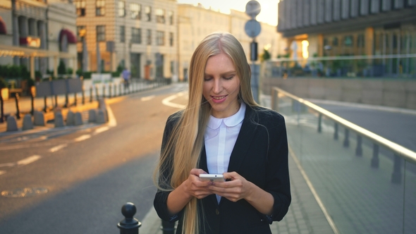 Formal Business Woman Walking on Street. Elegant Blond Woman in Suit ...