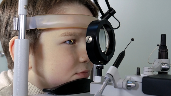 Optometrist Performing Visual Field Test of Young Boy, Stock Footage